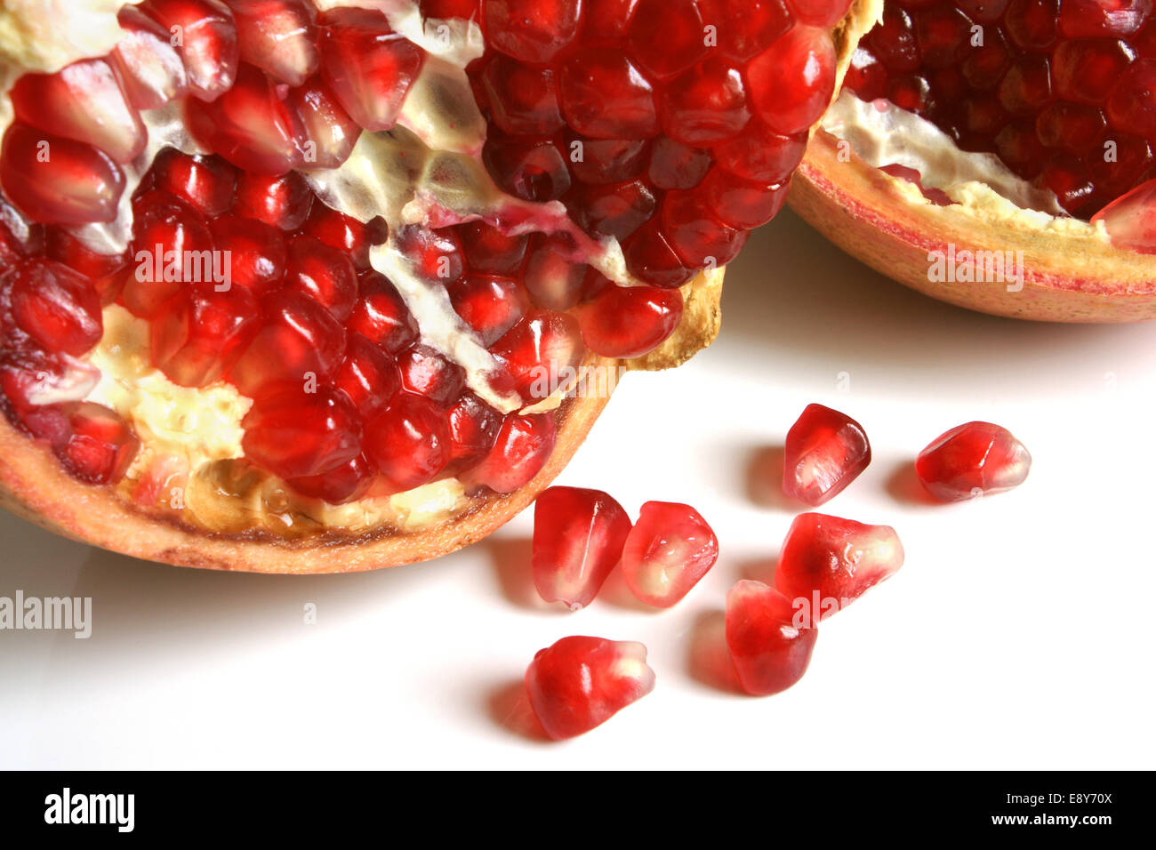 Open pomegranate with seeds Stock Photo - Alamy