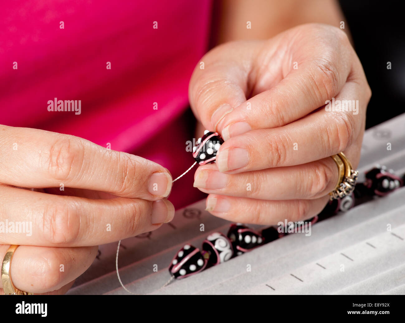 Making bead necklace Stock Photo - Alamy