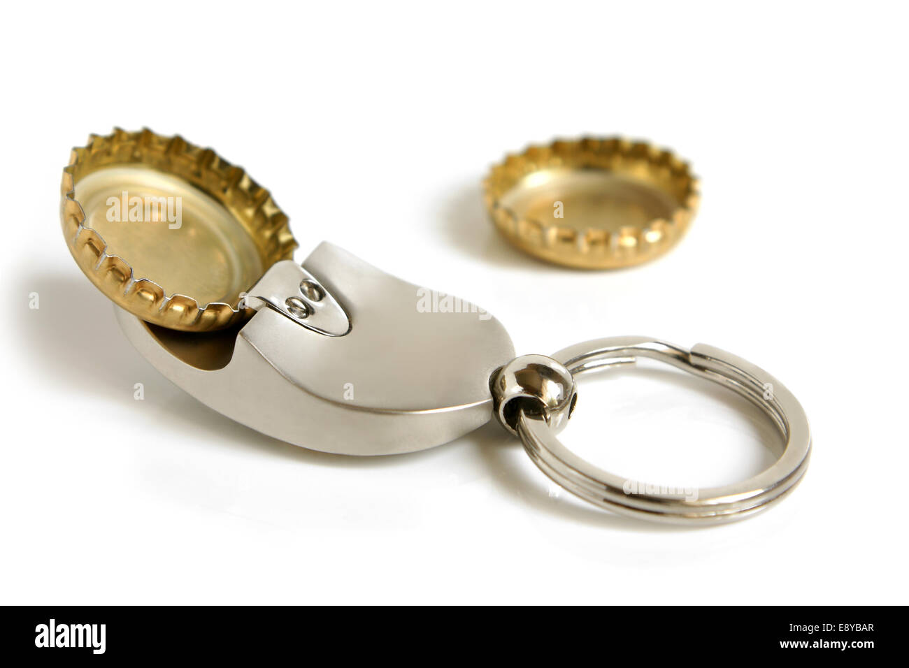 Bottle opener and caps Stock Photo - Alamy