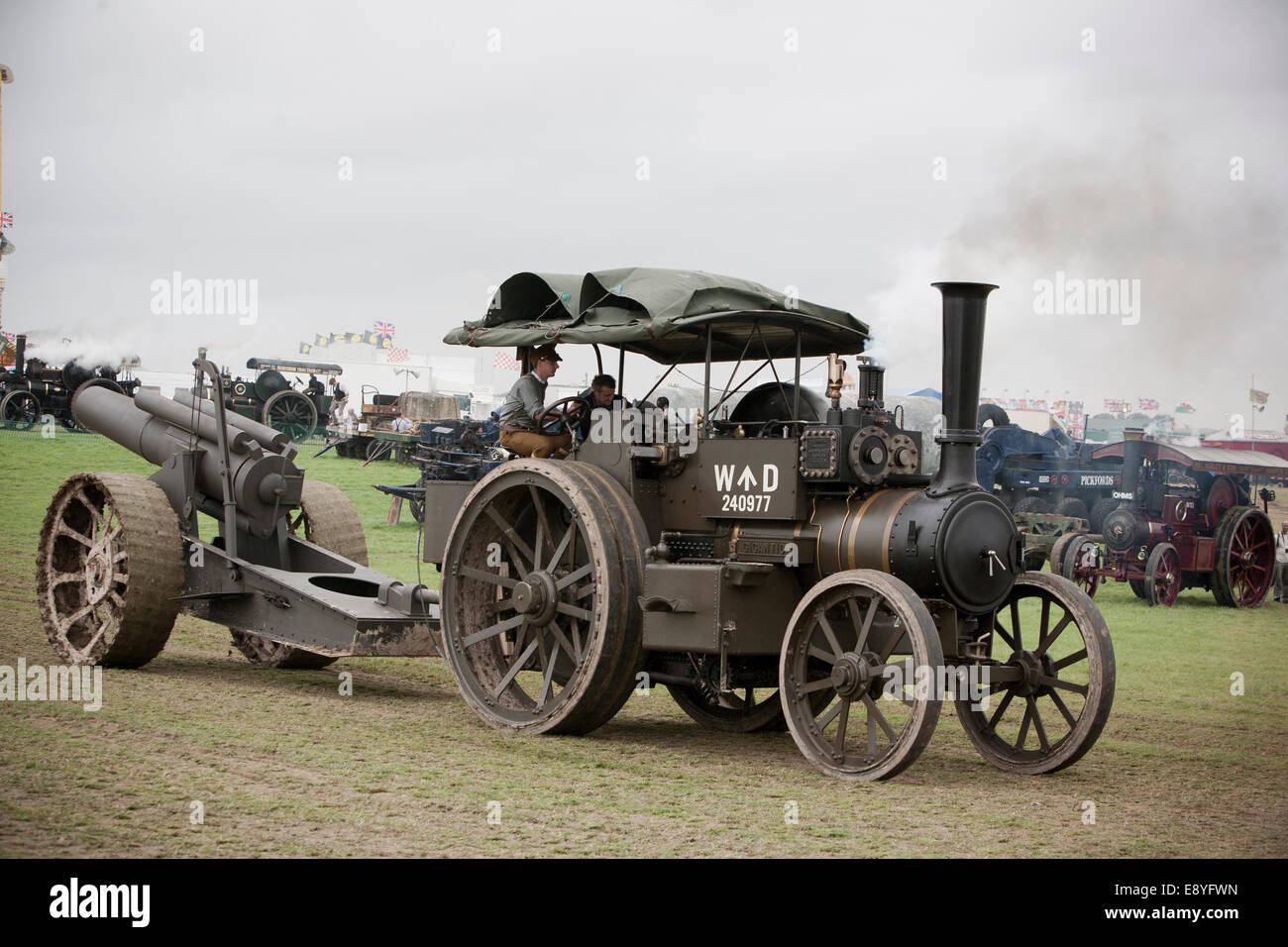 A War Department (WD) Mclaren Steam Traction Engine towing a replica ...