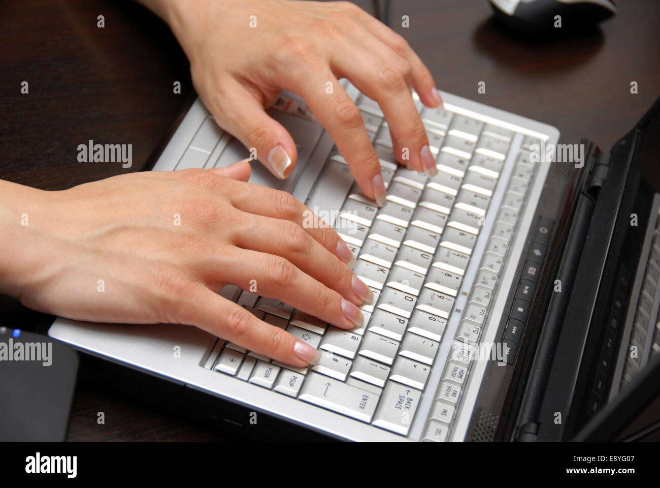 Hands on keyboard Stock Photo - Alamy