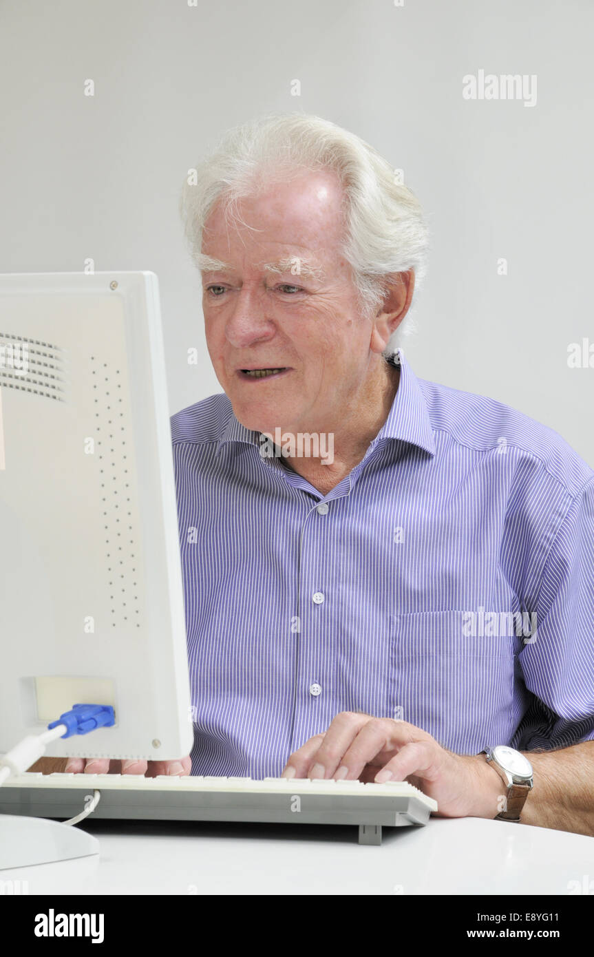 Senior with computer Stock Photo - Alamy