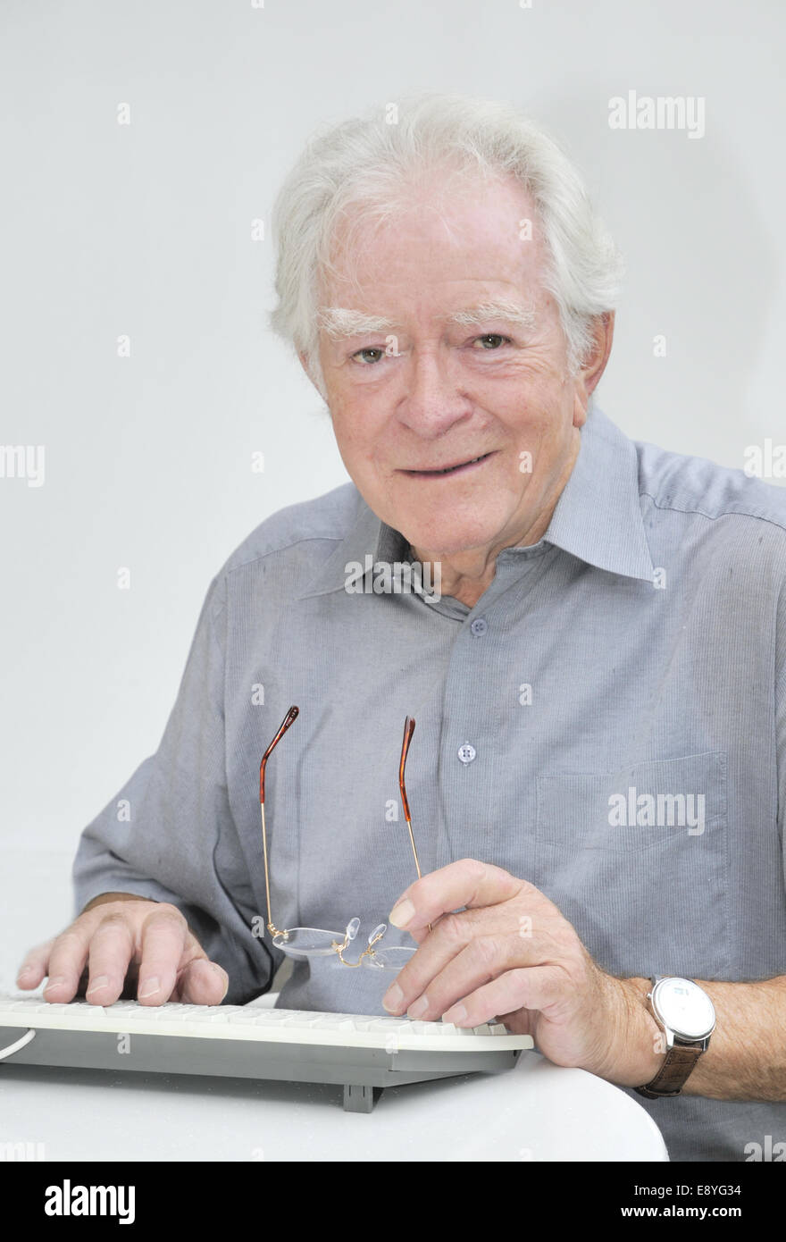 Elderly man with computer Stock Photo - Alamy