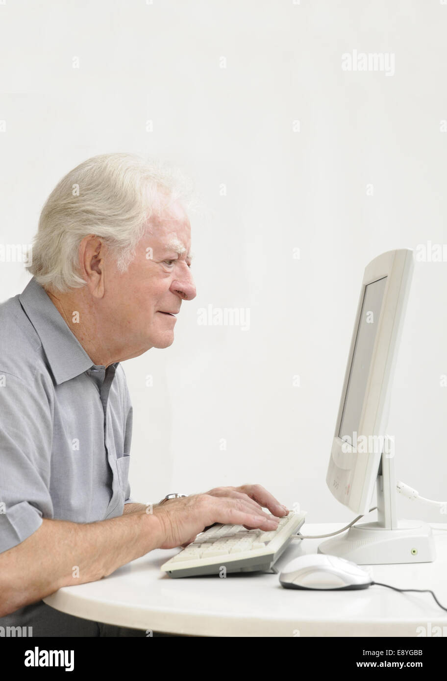 Elderly man with computer Stock Photo - Alamy