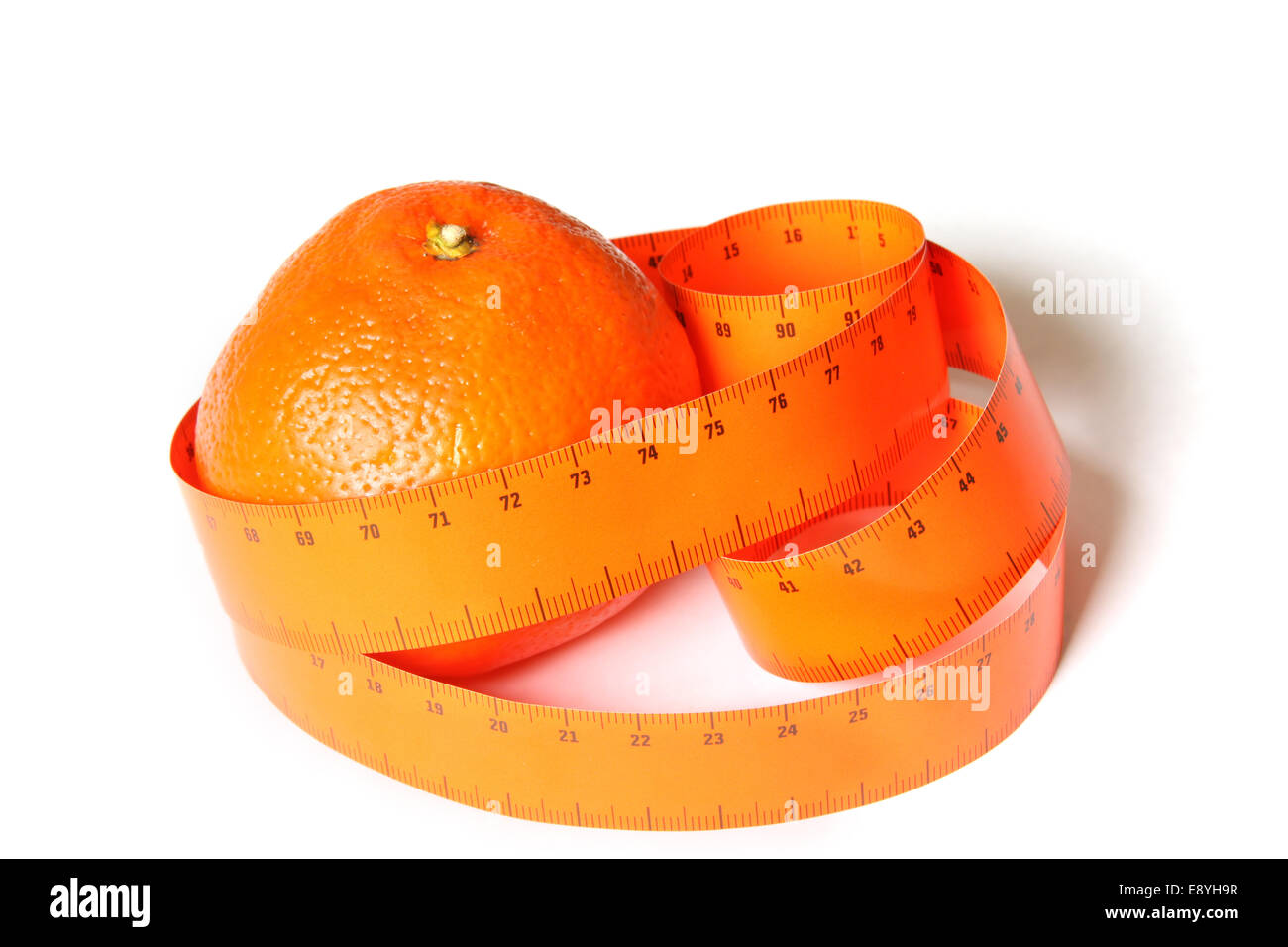 Orange and measuring tape. Isolated on white Stock Photo - Alamy