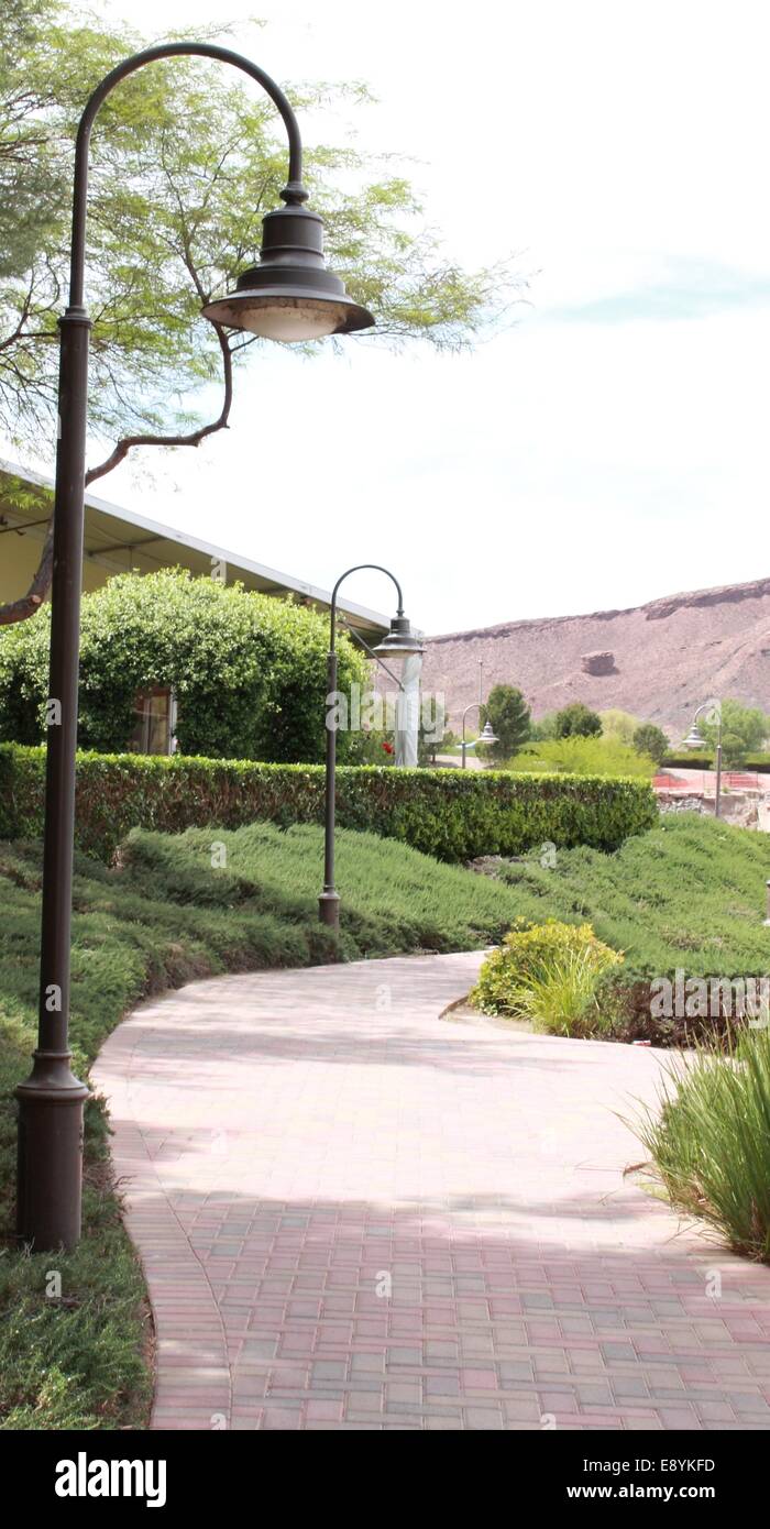 Serene path lined with lamp posts Stock Photo - Alamy