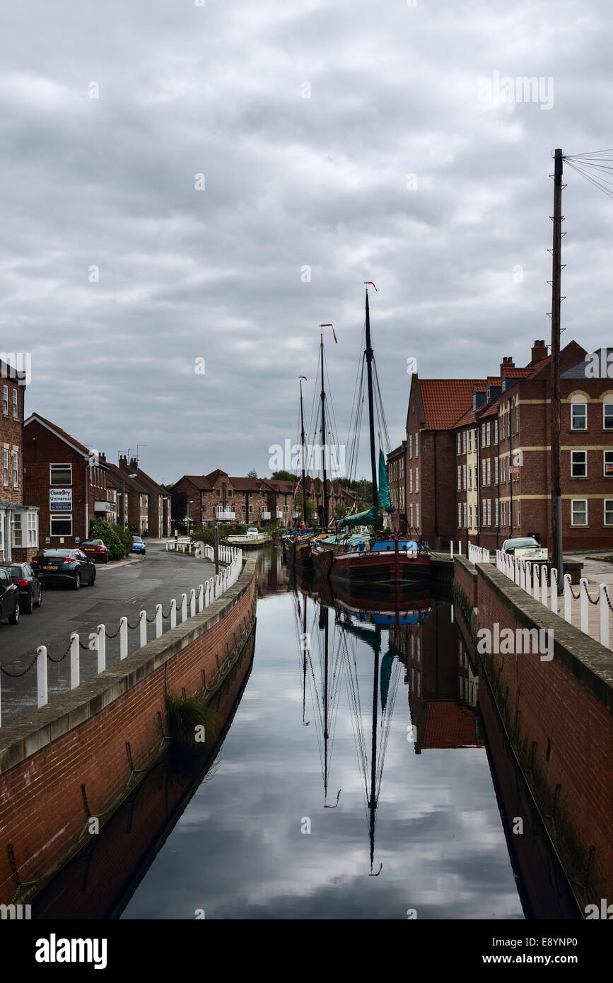 Old, vintage, barges anchored along the bank of the beck at Beverley ...