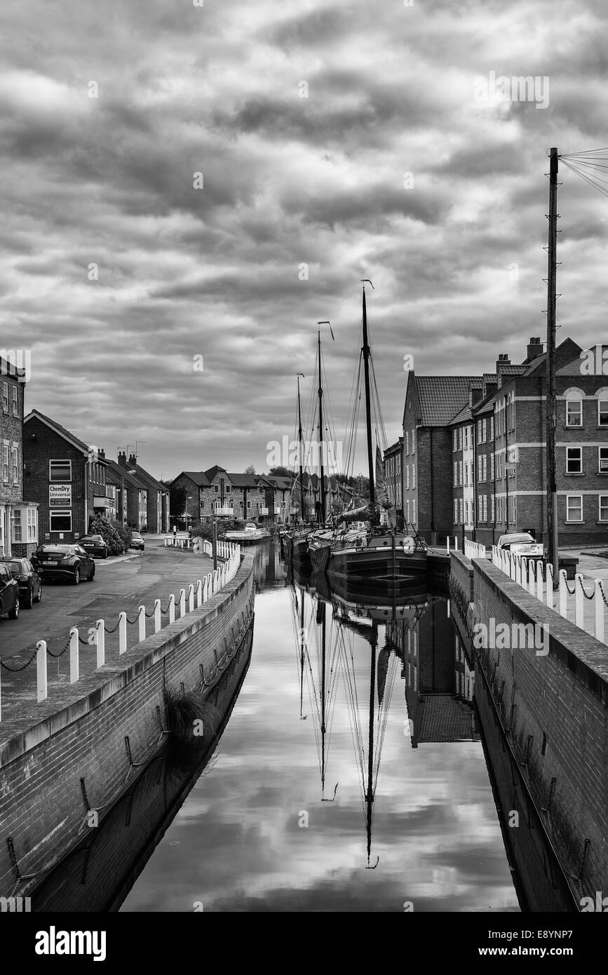 Old, vintage, barges anchored along the bank of the beck at Beverley ...