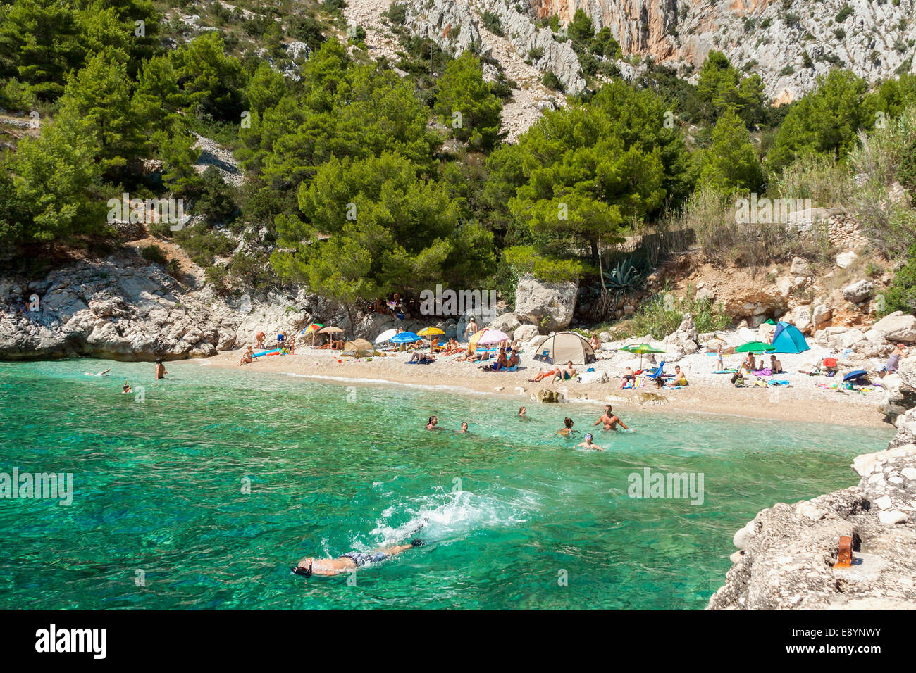 Tourists on Lucisca beach near Sveta Nedilja village, Hvar island ...