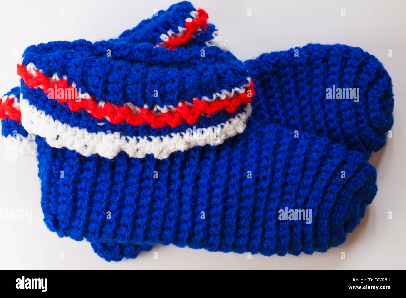 hand knitted blue slippers socks with Ric Rac trim set on white ...