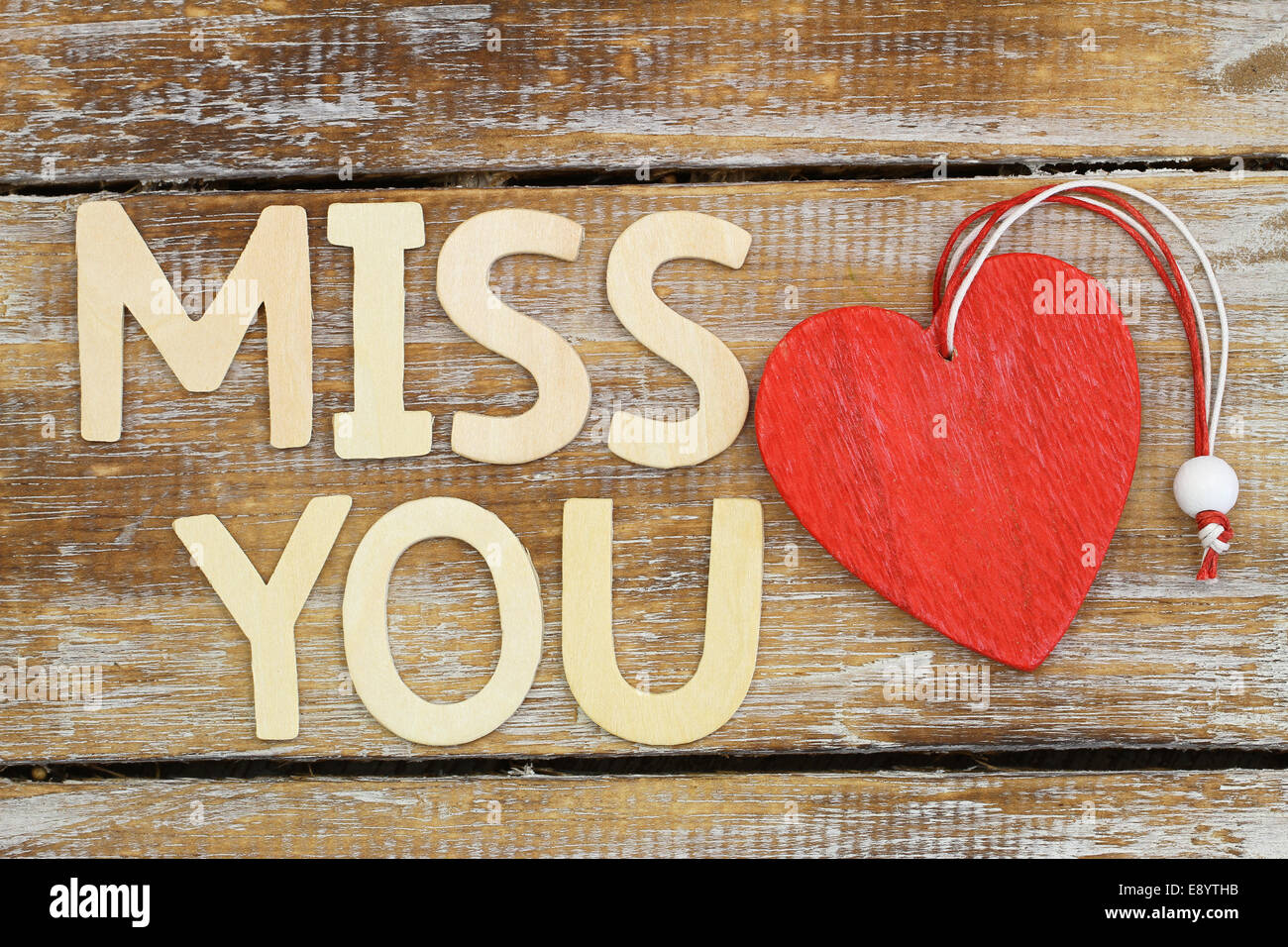 "Miss you" written with wooden letters next to red wooden heart Stock ...
