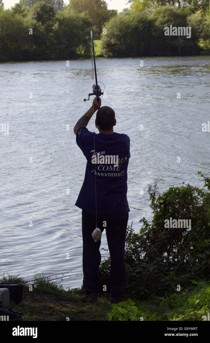 Man carp fishing on lake in Gloucestershire England UK Stock Photo - Alamy