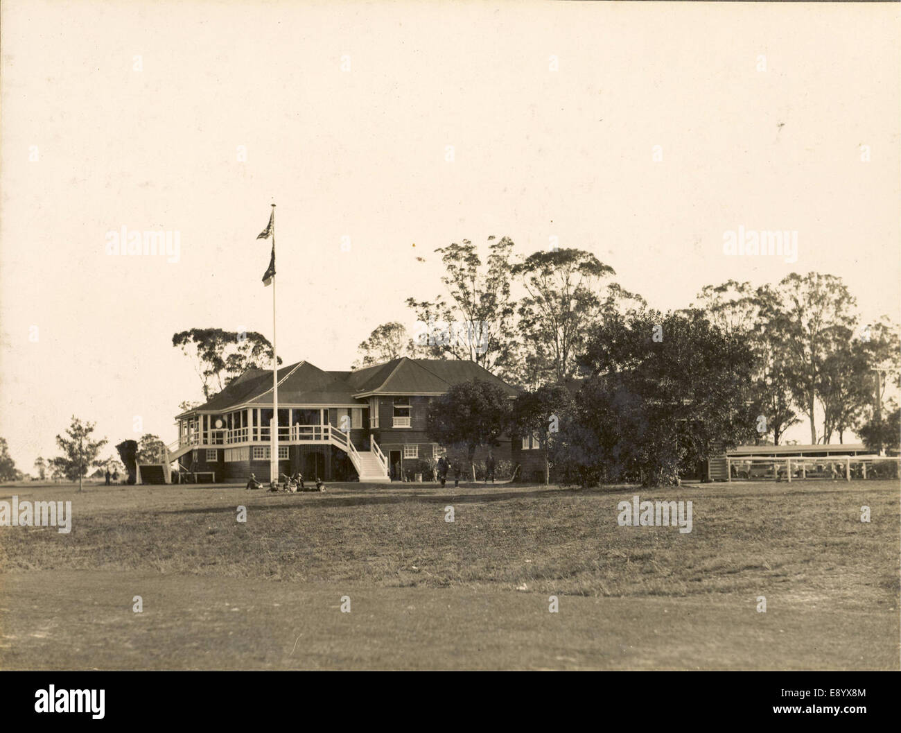 This photograph features a traditional clubhouse, showcasing its ...