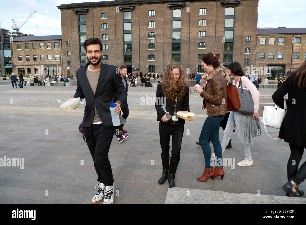 On a warm autumn afternoon people buy lunch from KERB street food vans ...