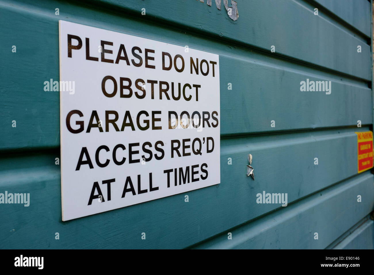 Garage door sign 'Please do not obstruct garage doors access req'd at ...
