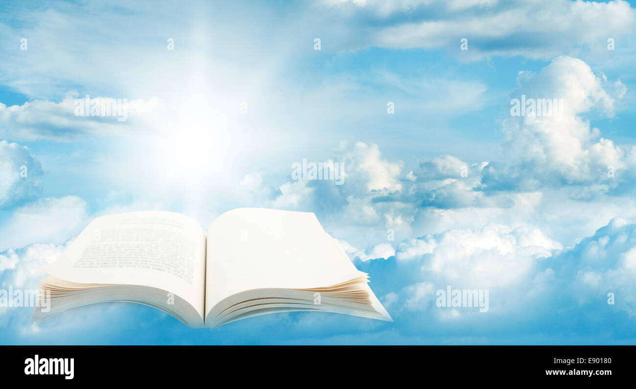 Open book in blue sky Stock Photo - Alamy