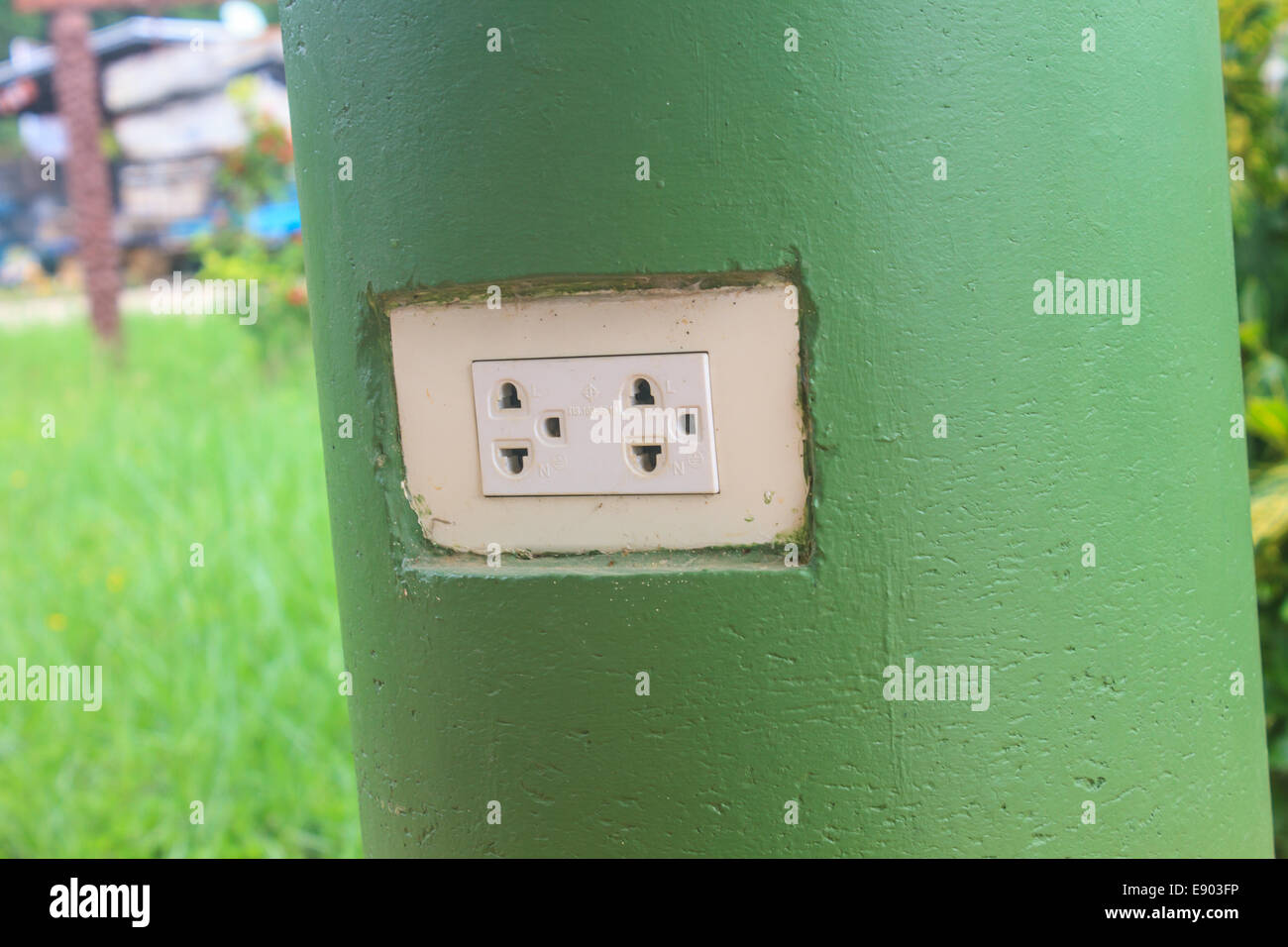 plug the power electrical mounted on stone poles Stock Photo - Alamy