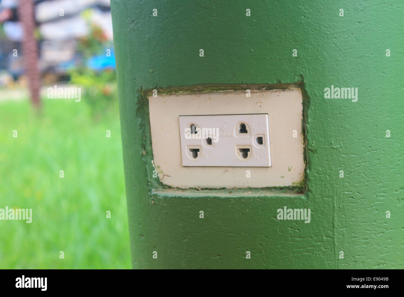 plug the power electrical mounted on stone poles Stock Photo - Alamy