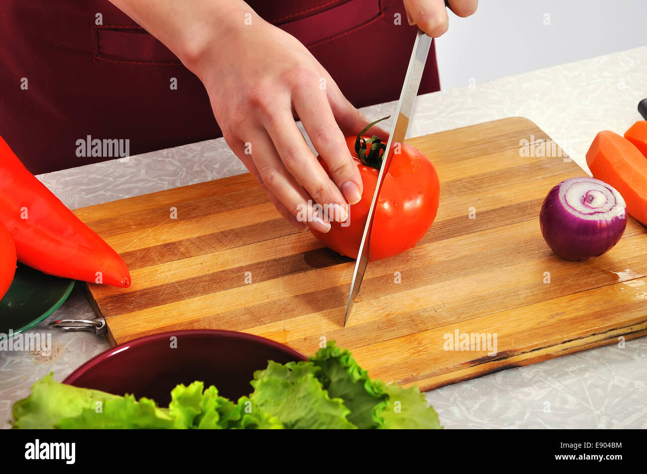 young woman slicing vegetables food, close up Stock Photo - Alamy