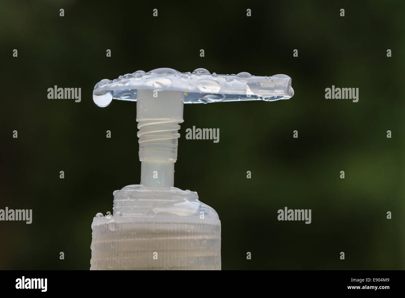 close up drop water on pump of bottle Stock Photo - Alamy