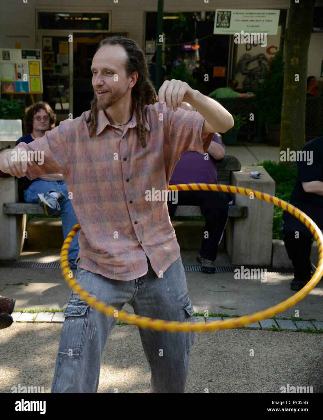 Man playing with a hoola hoop Stock Photo - Alamy