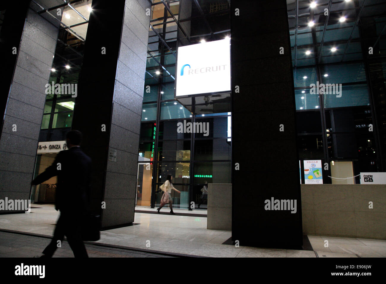 Tokyo, Japan. 16th Oct, 2014. Passers-by walk near the Recruit Holdings ...