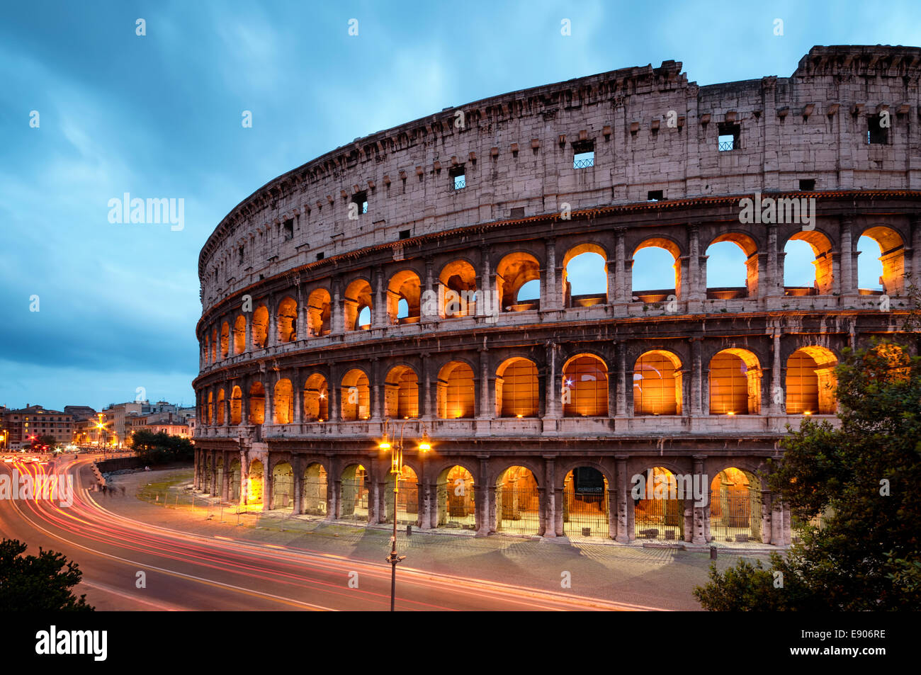 Colosseum at night with colorful blurred traffic lights.Rome - Italy ...