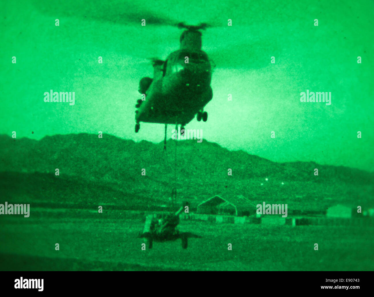 A U.S. Army CH-47 Chinook helicopter prepares to transport an M777A2 ...