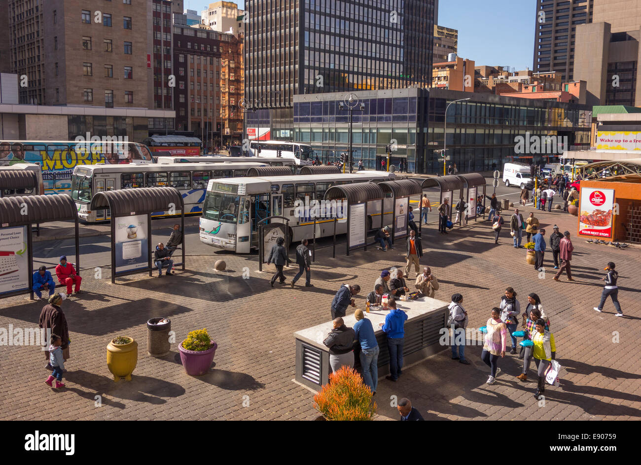 JOHANNESBURG, SOUTH AFRICA - People and buses, in Gandhi Square, in ...