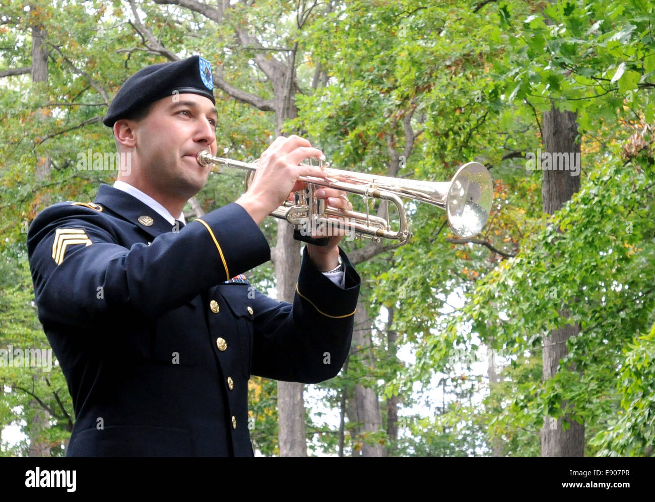 U.S. Army Staff Sgt. Jeff Hotz, a bugler with the 338th Army Band, U.S ...