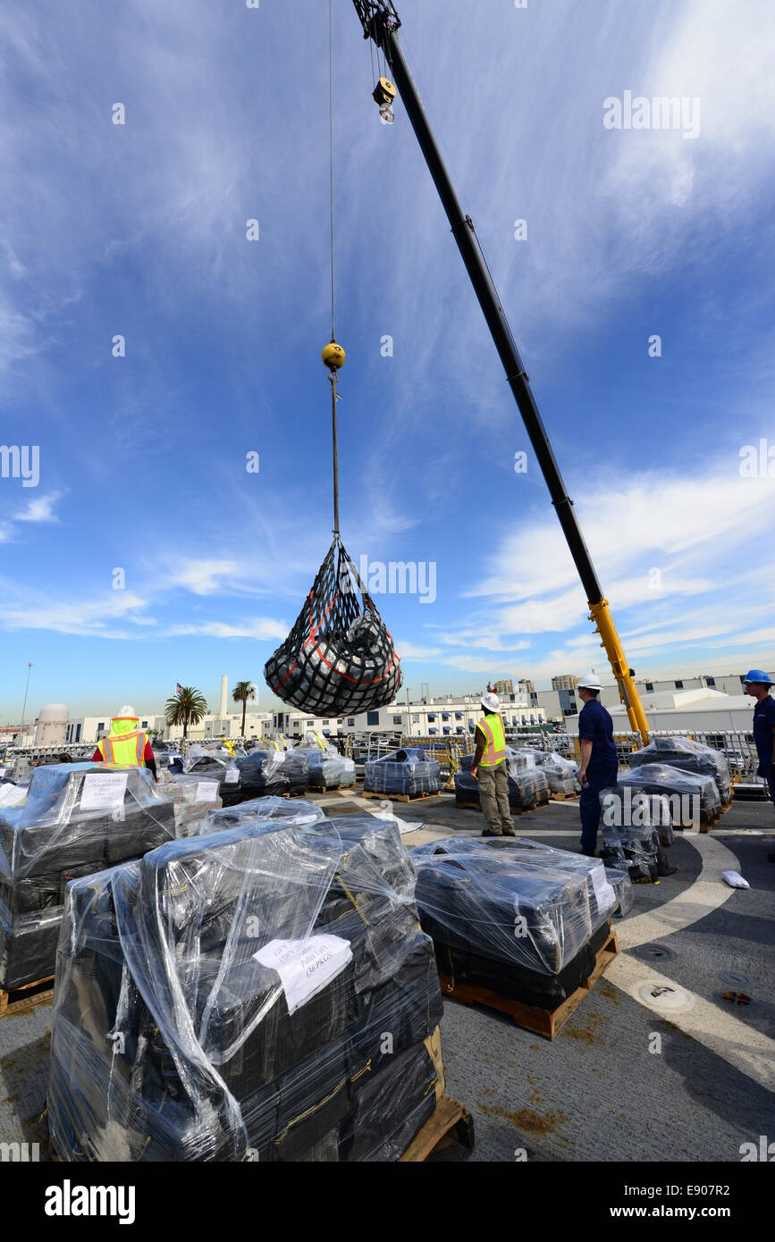 U.S. Coast Guardsmen and civilian crane operators offload 28,000 pounds ...