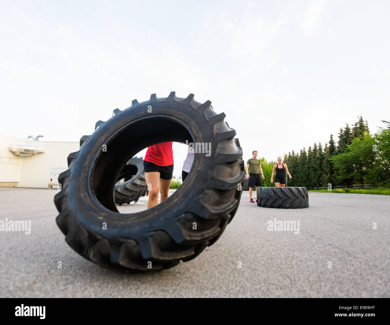 Athlete Lifting Large Tractor Tire Stock Photo - Alamy