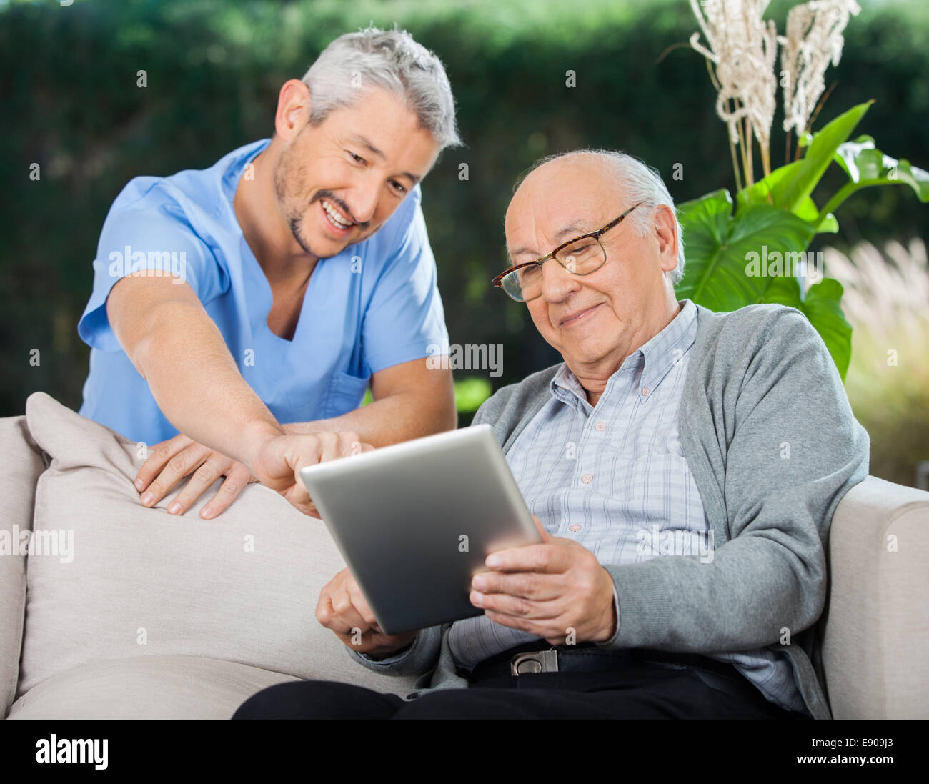 Male nurse helping patient hi-res stock photography and images - Alamy