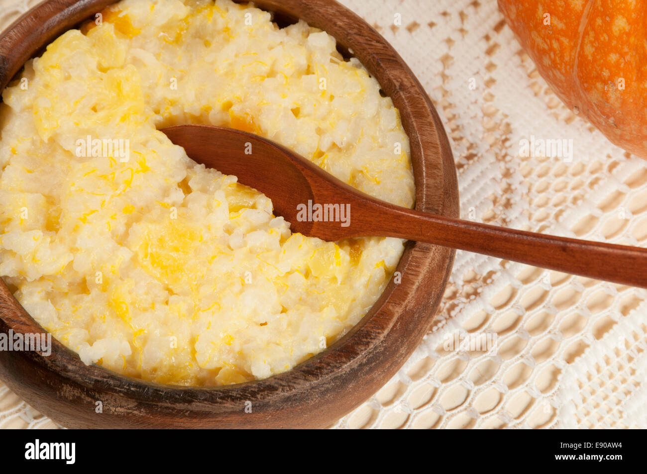 Rice kasha with pumpkin in a timber bowl Stock Photo - Alamy