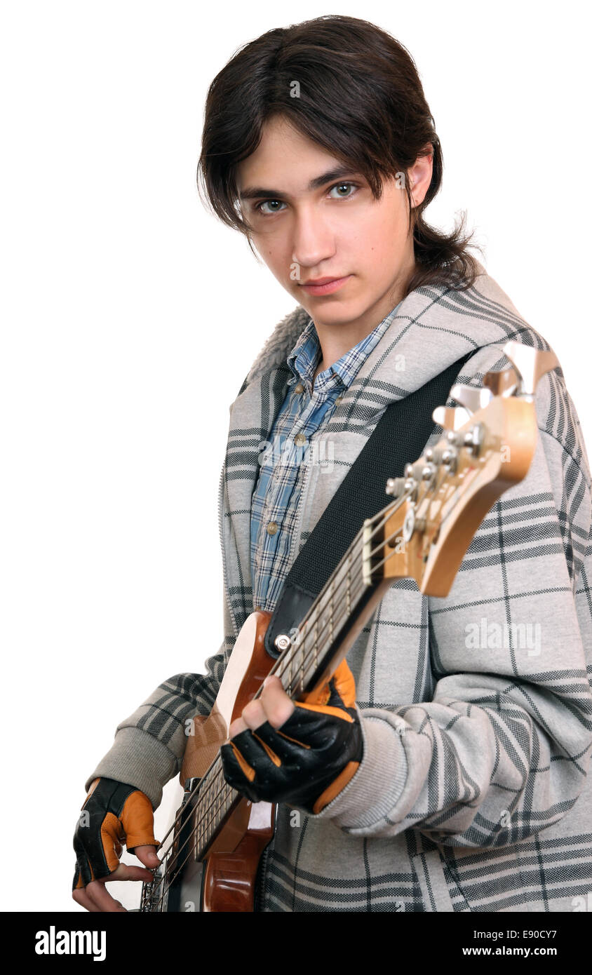 Teen rock musician playing bass guitar Stock Photo - Alamy