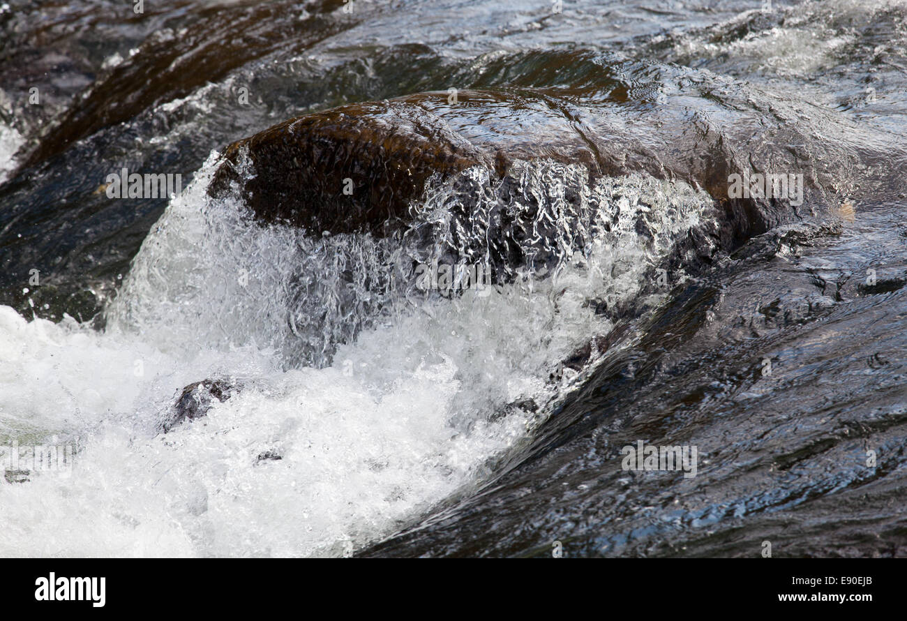 Rushing river over waterfall Stock Photo - Alamy
