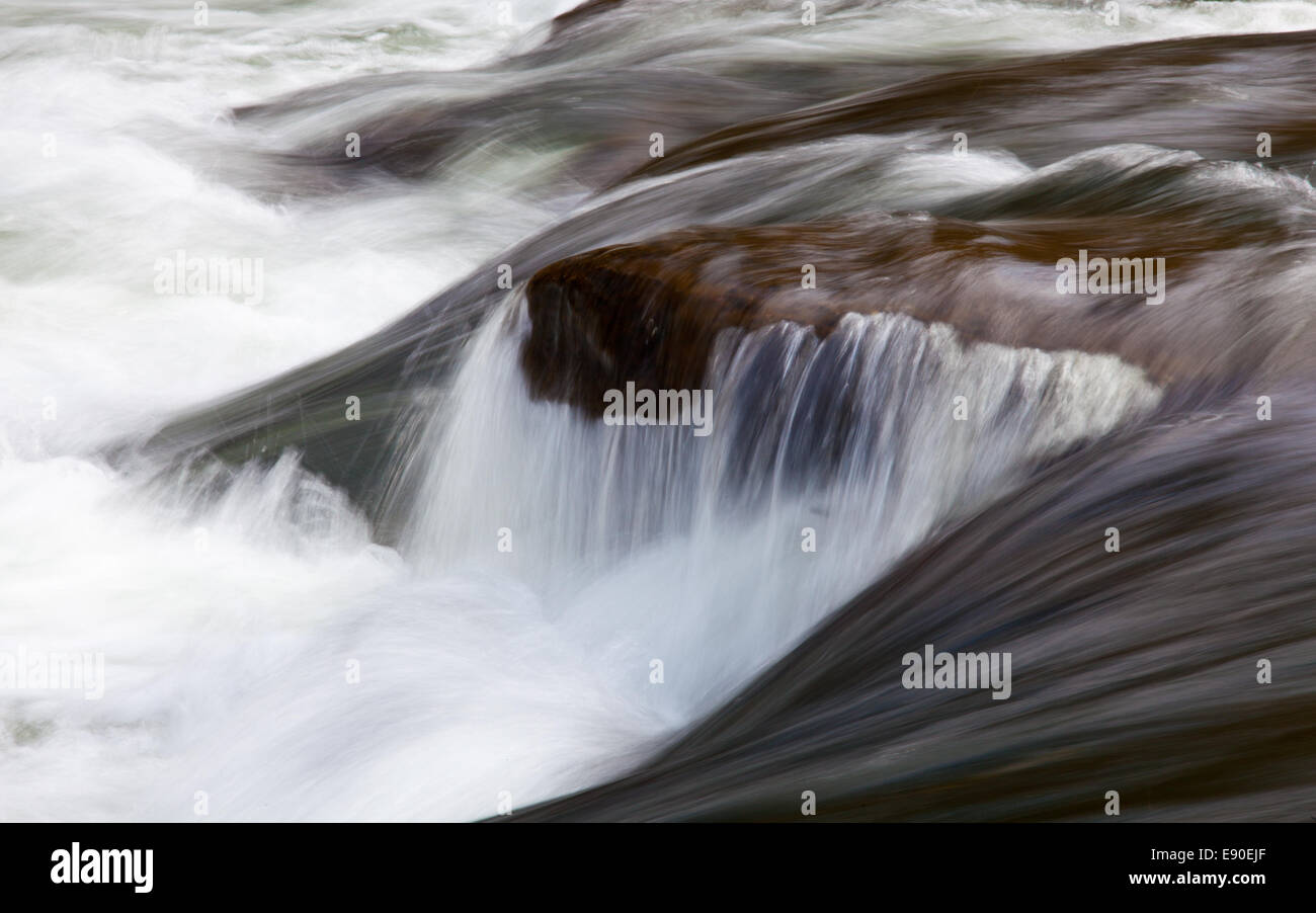Rushing river over waterfall Stock Photo - Alamy