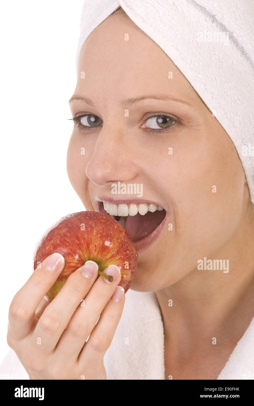 Woman biting into the apple Stock Photo - Alamy