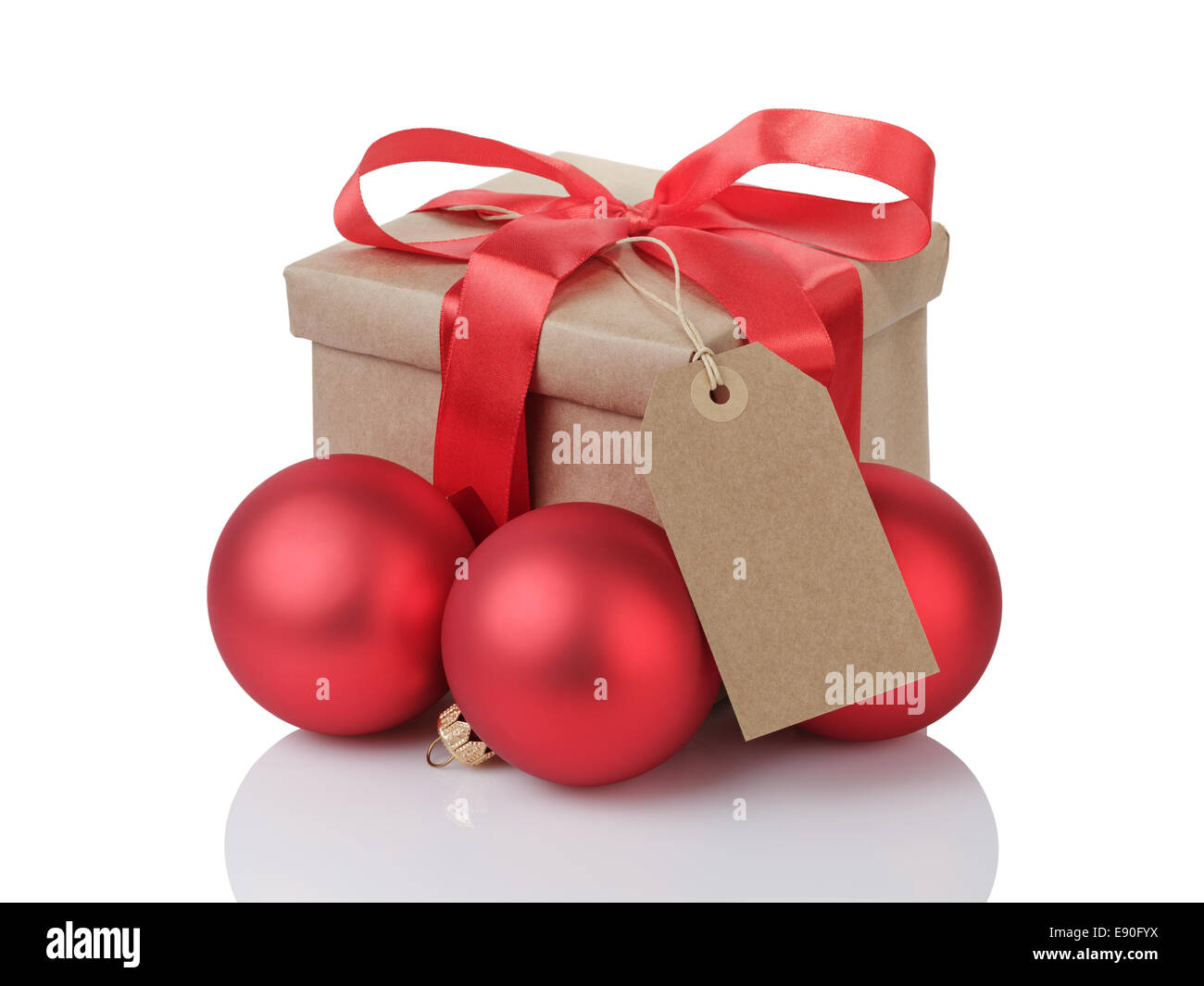 wraped gift box with red bow, christmas balls and tag, isolated on ...