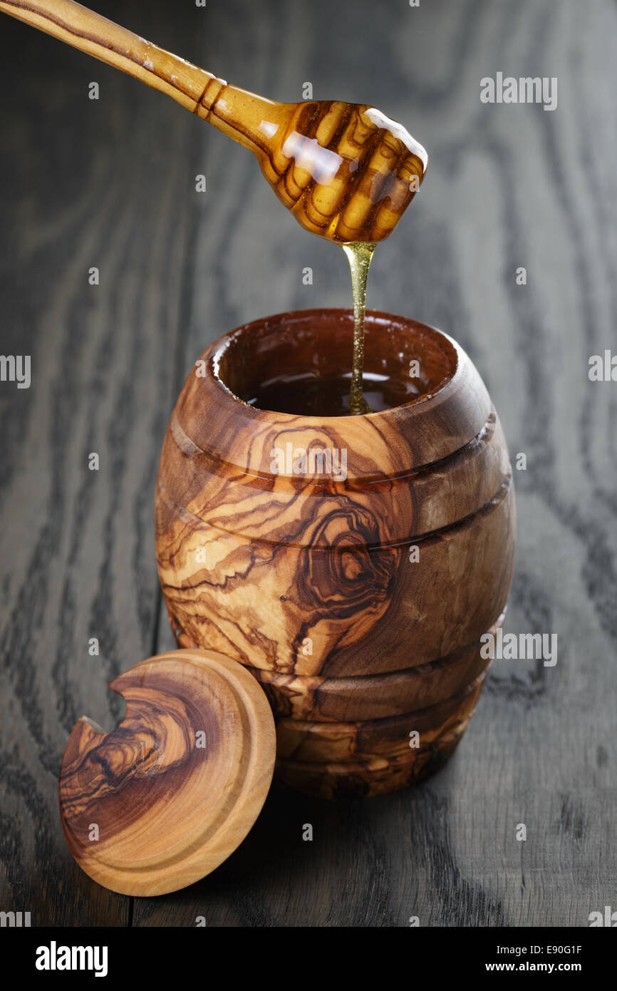 maple honey flowing from dipper to pot, rustic style Stock Photo - Alamy