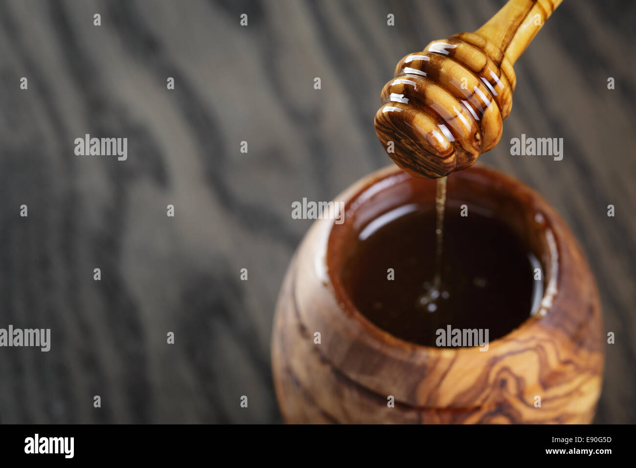maple honey flowing from dipper to pot, rustic style Stock Photo - Alamy