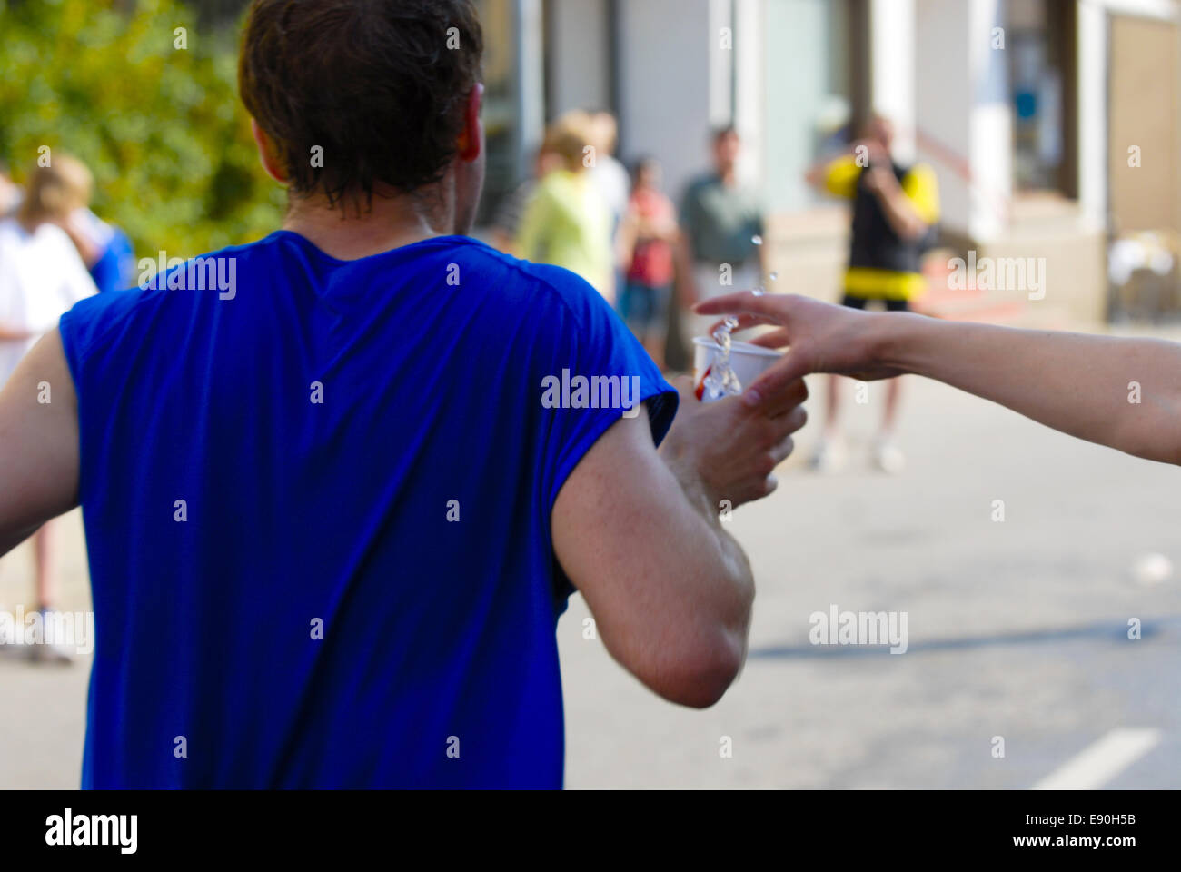 Drinking while jogging Stock Photo - Alamy