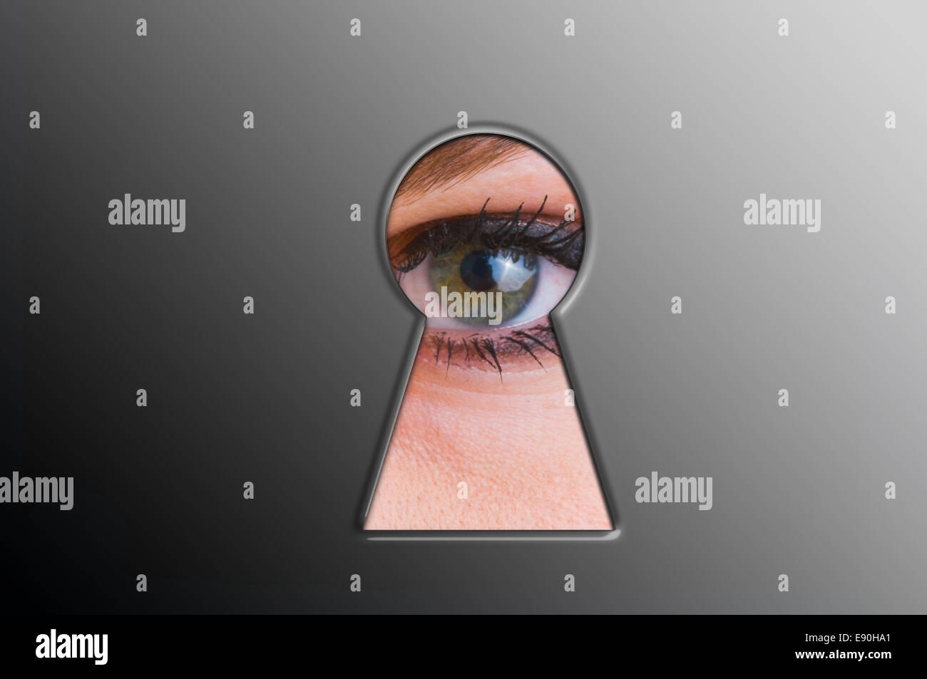 Woman looks through a keyhole Stock Photo - Alamy