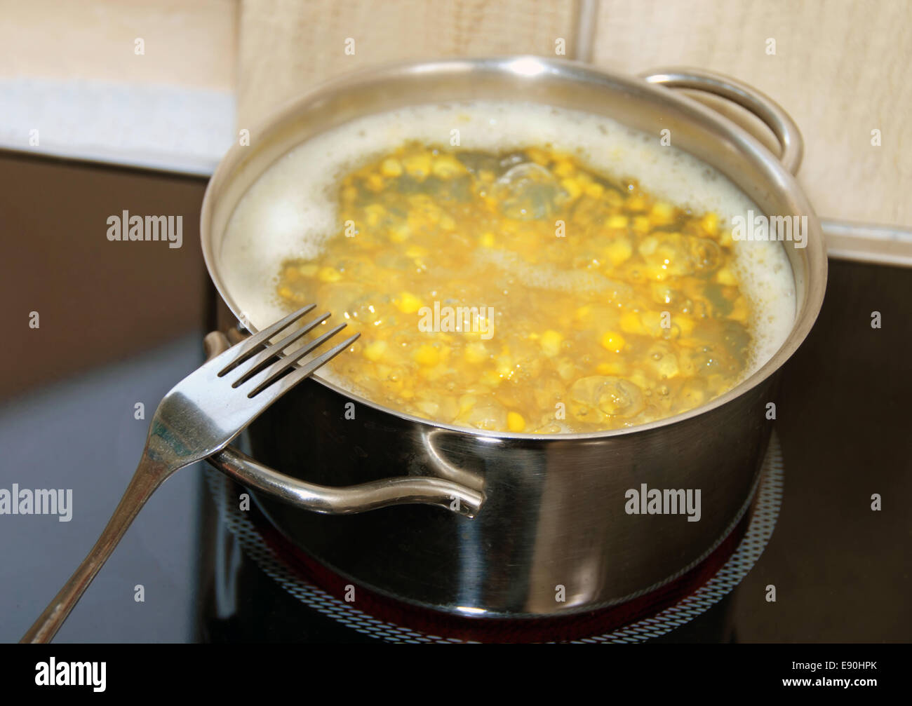 Cooking corn in pot Stock Photo - Alamy