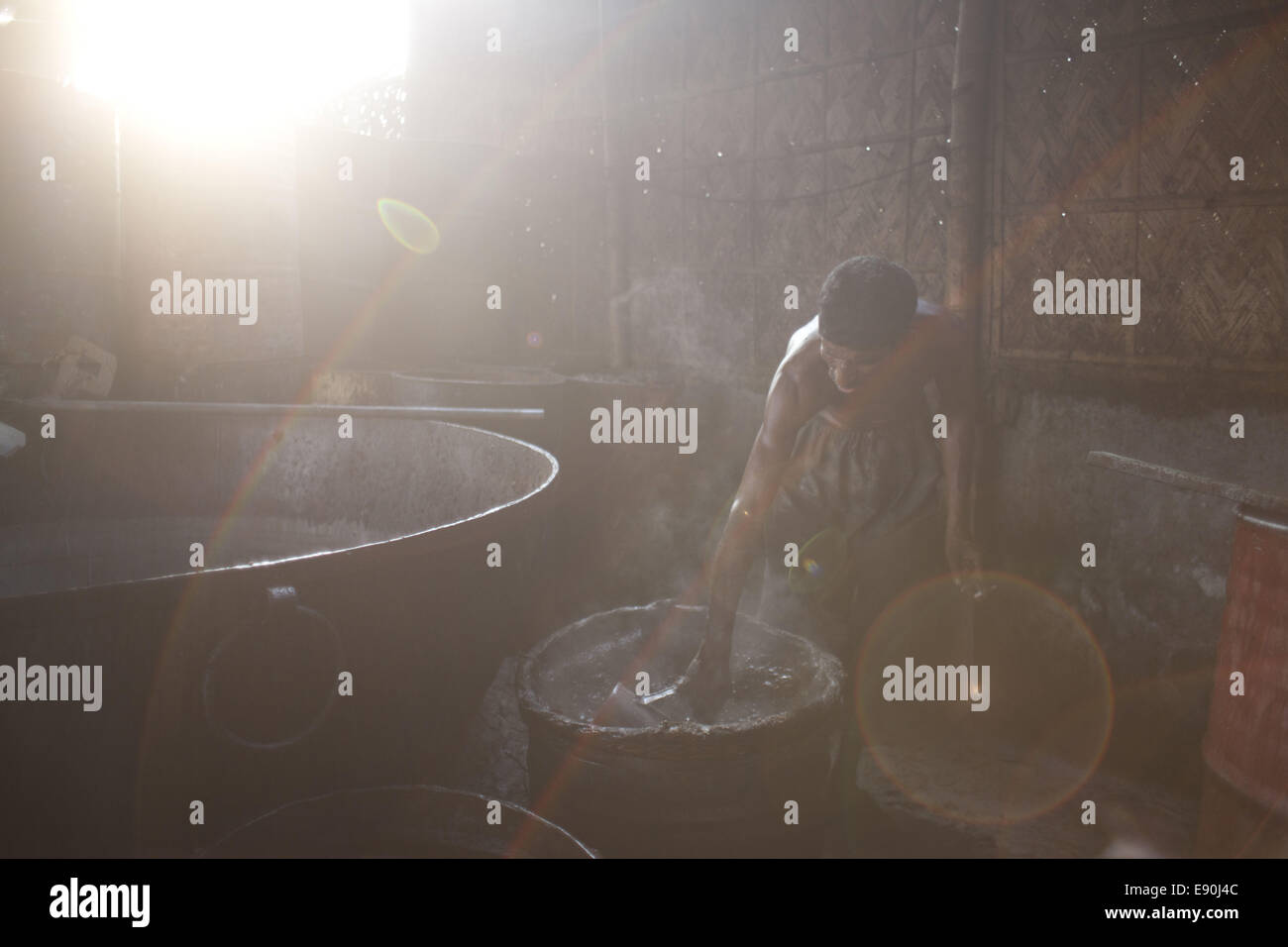 Dhaka, Bangladesh. 16th Oct, 2014. A Bangladeshi worker collects fat ...