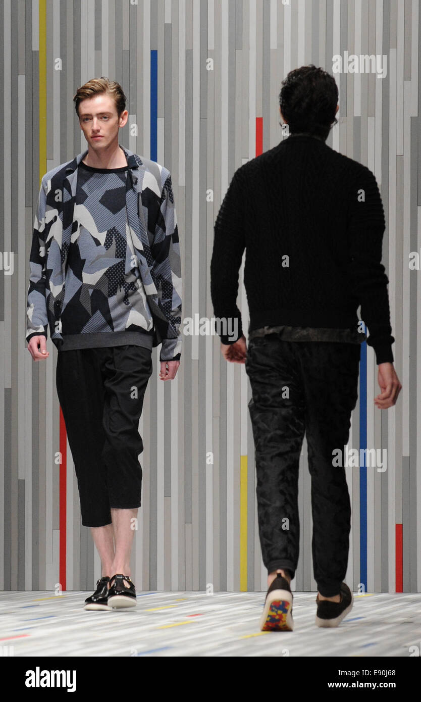 Tokyo, Japan. 17th Oct, 2014. Models display creations designed by Koji ...