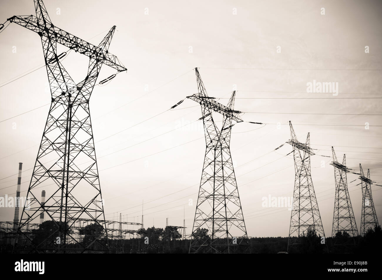 Transmission power line in sunset Stock Photo - Alamy
