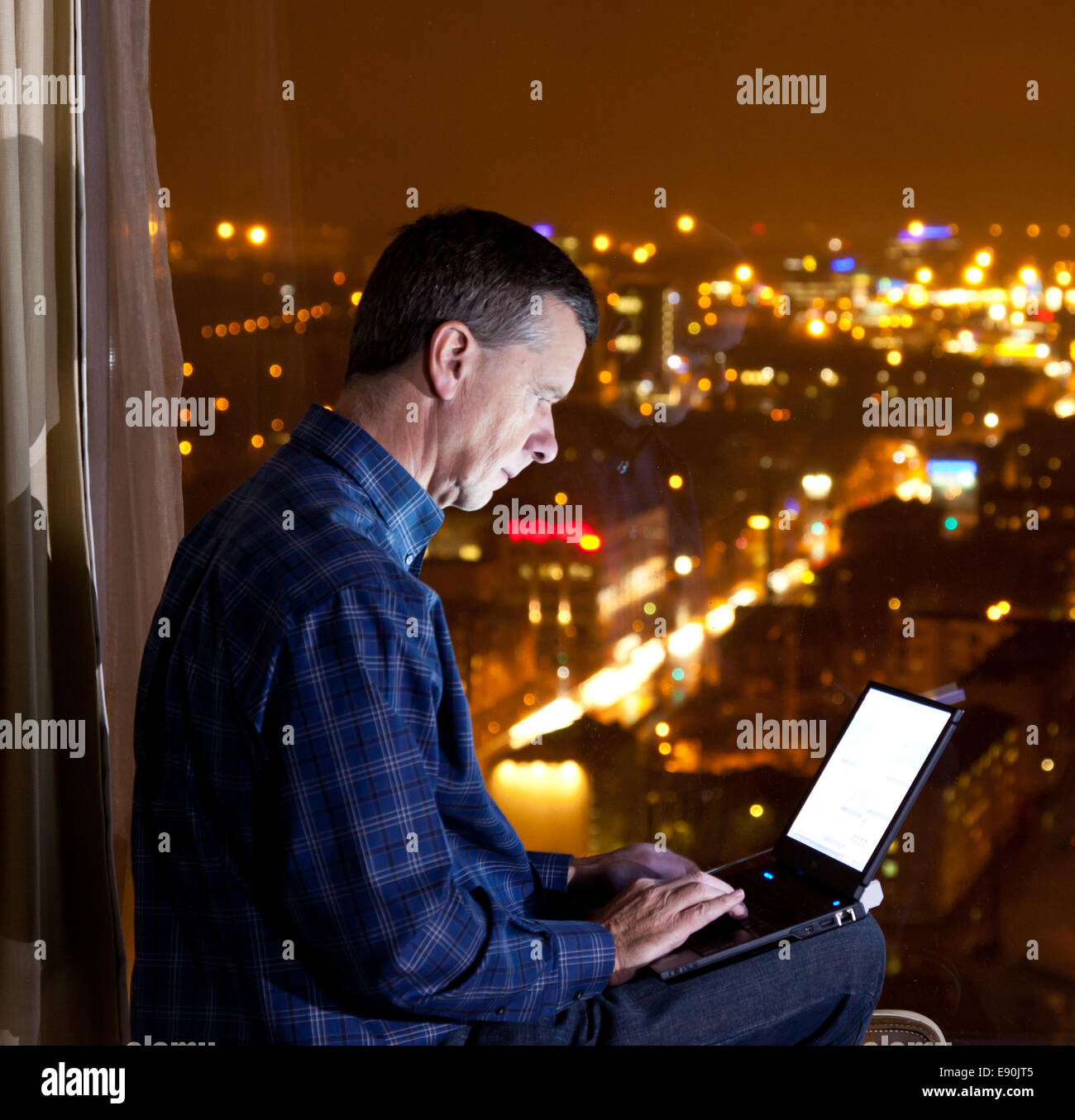 Man looking over city Stock Photo - Alamy