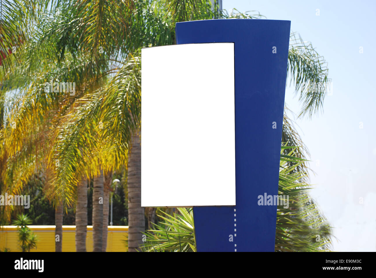 A Blank white Sign on blue background Stock Photo - Alamy