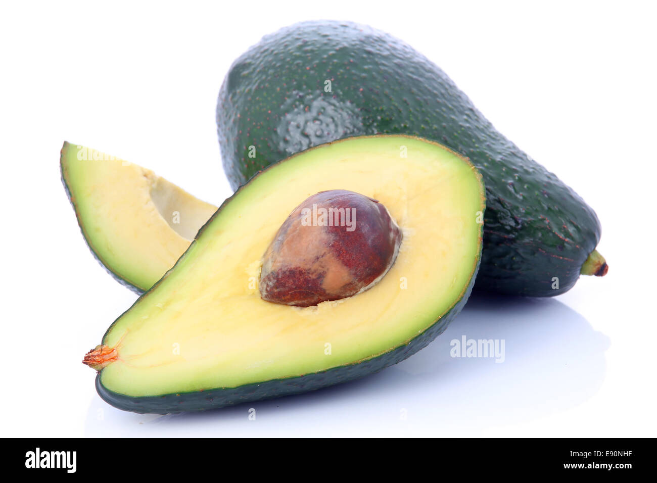 Ripe sliced avocado fruits isolated on white Stock Photo - Alamy